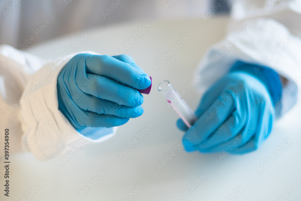 Process of coronavirus testing examination by nurse medic in laboratory ...