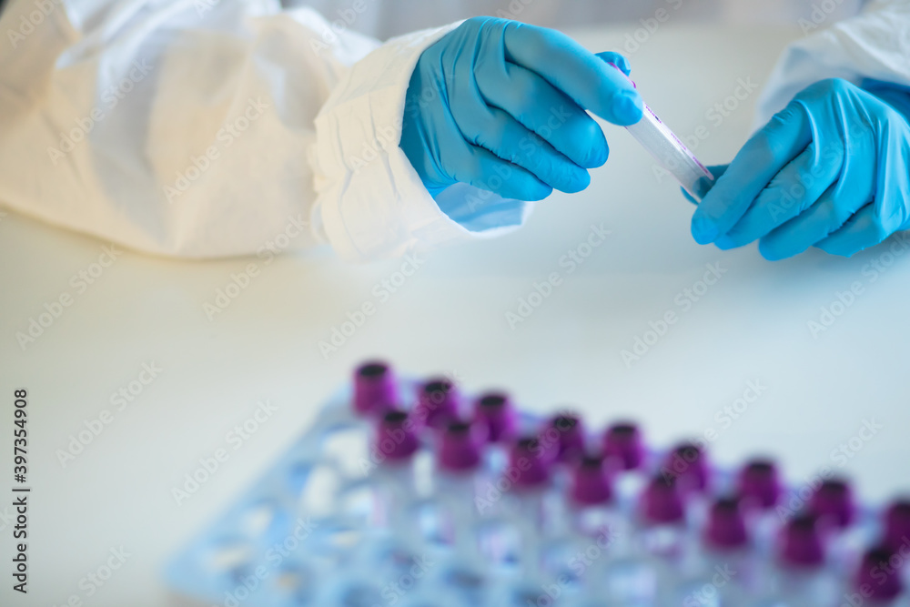 Process of coronavirus testing examination by nurse medic in laboratory ...