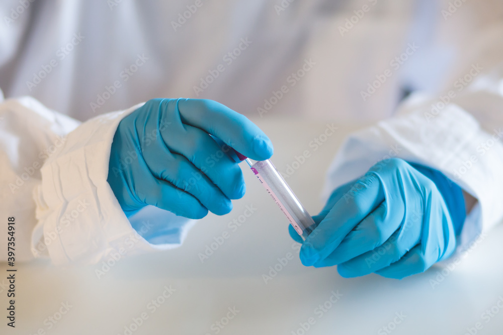 Process of coronavirus testing examination by nurse medic in laboratory ...