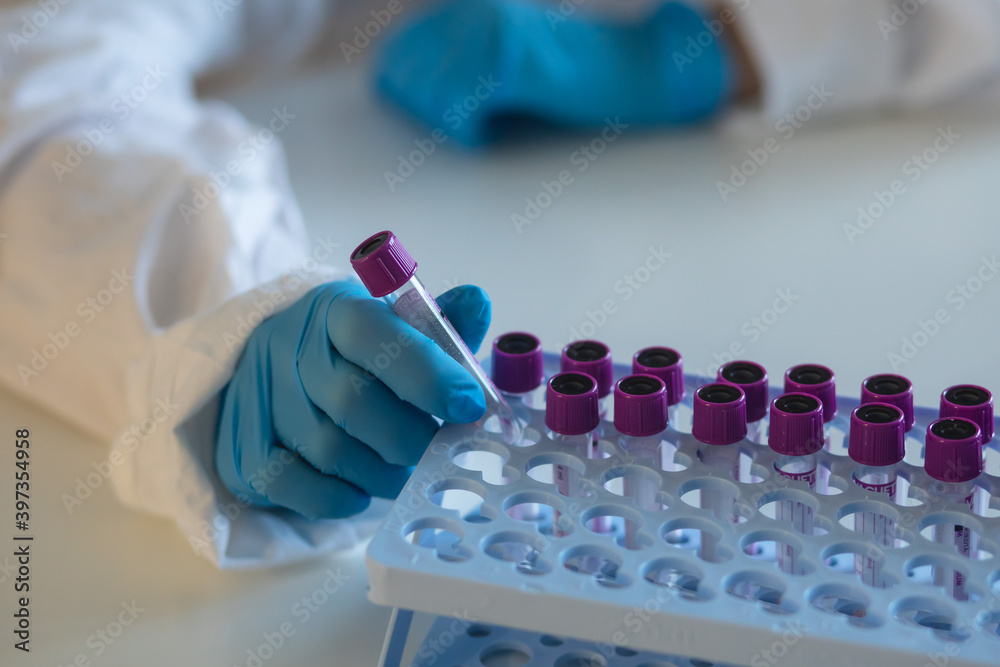 Process of coronavirus testing examination by nurse medic in laboratory ...