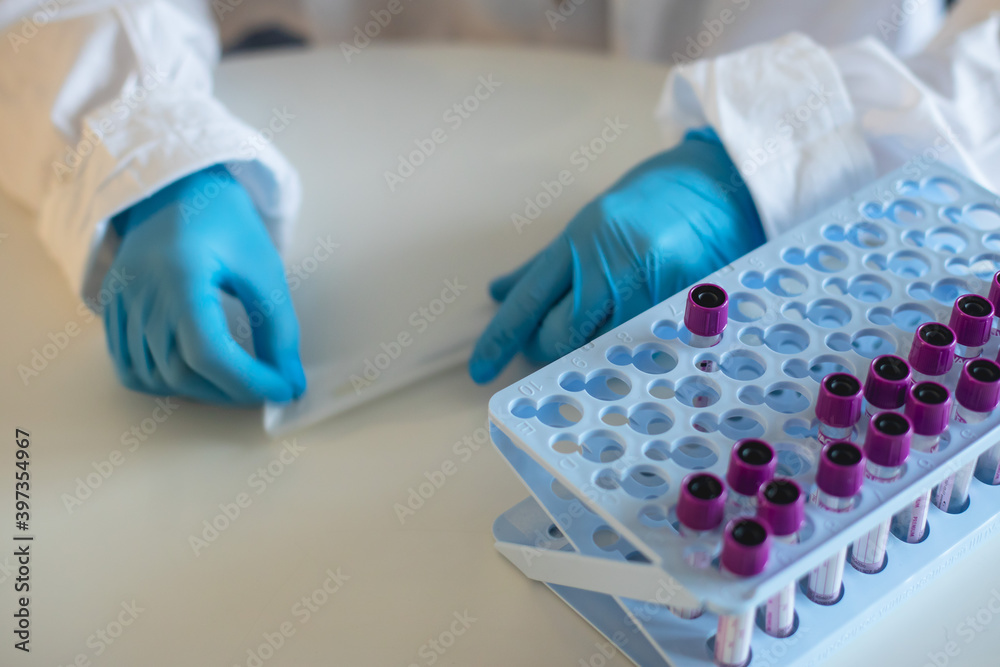 Process of coronavirus testing examination by nurse medic in laboratory ...