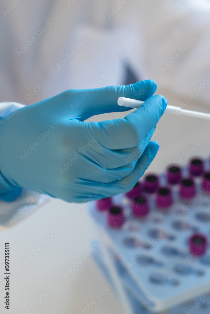 Process of coronavirus testing examination by nurse medic in laboratory ...