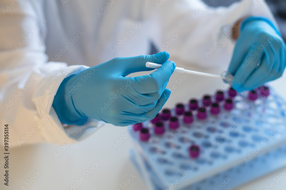 Process of coronavirus testing examination by nurse medic in laboratory ...