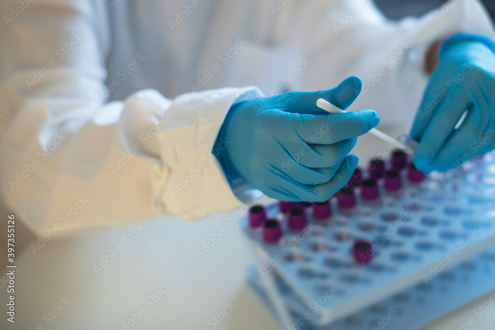 Process of coronavirus testing examination by nurse medic in laboratory ...