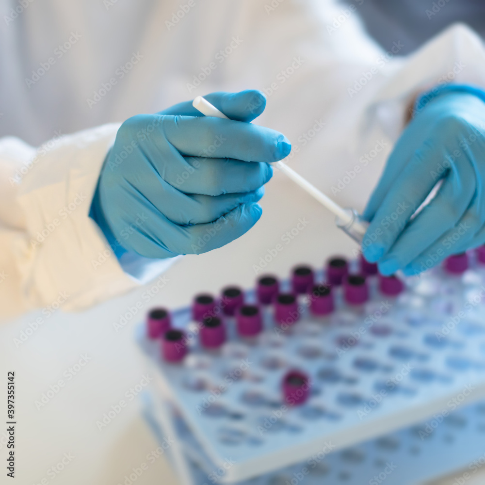 Process of coronavirus testing examination by nurse medic in laboratory ...