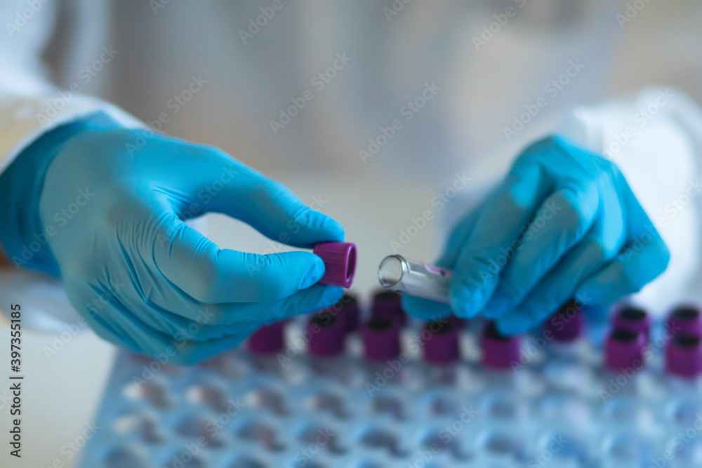 Process of coronavirus testing examination by nurse medic in laboratory ...