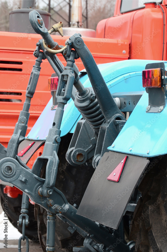 Wheels of back view of new tractor in snowy weather. Agricultural ...