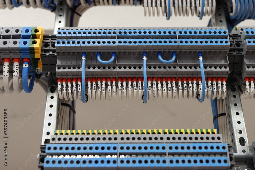 Pass-through terminals for connecting loads in electrical panels ...