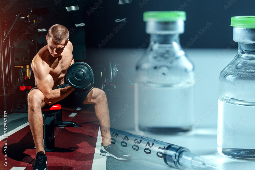 Bodybuilder in the gym, injecting a steroid syringe. Strong athletic ...
