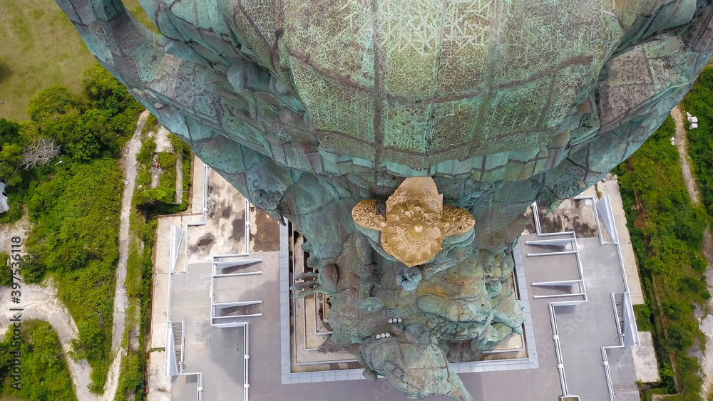 Top down view to statue of god Garuda. Aerial view statue hindu god ...