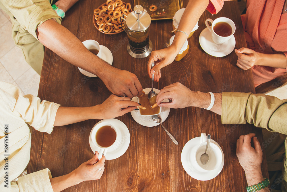 Friends drink herbal tea after spa treatments in the sauna. Concept ...