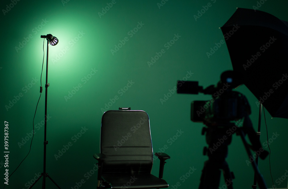 Green screen background and a black chair in a television Studio. Stock ...