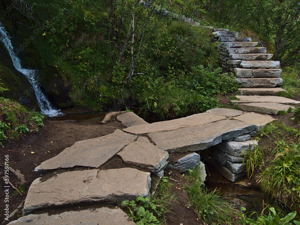 Rock bridge on hiking trail of stone material constructed by Nepali ...