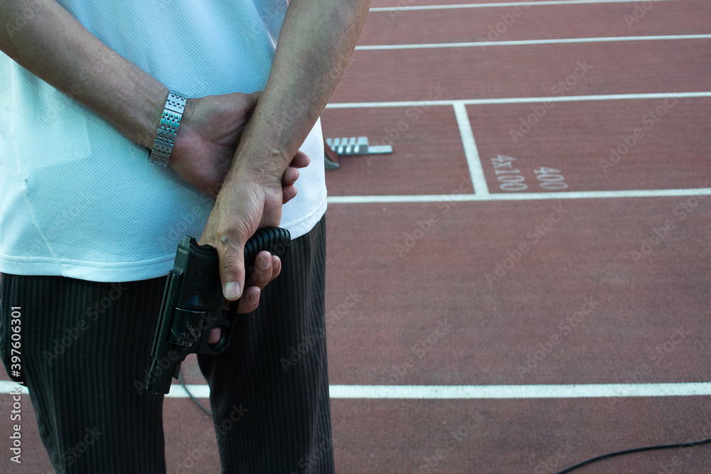 Referee pistol to start at the track and field competitions Stock Photo ...