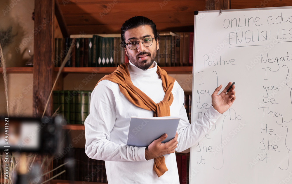Teacher Teaching Online Standing Near Blackboard Explaining English ...