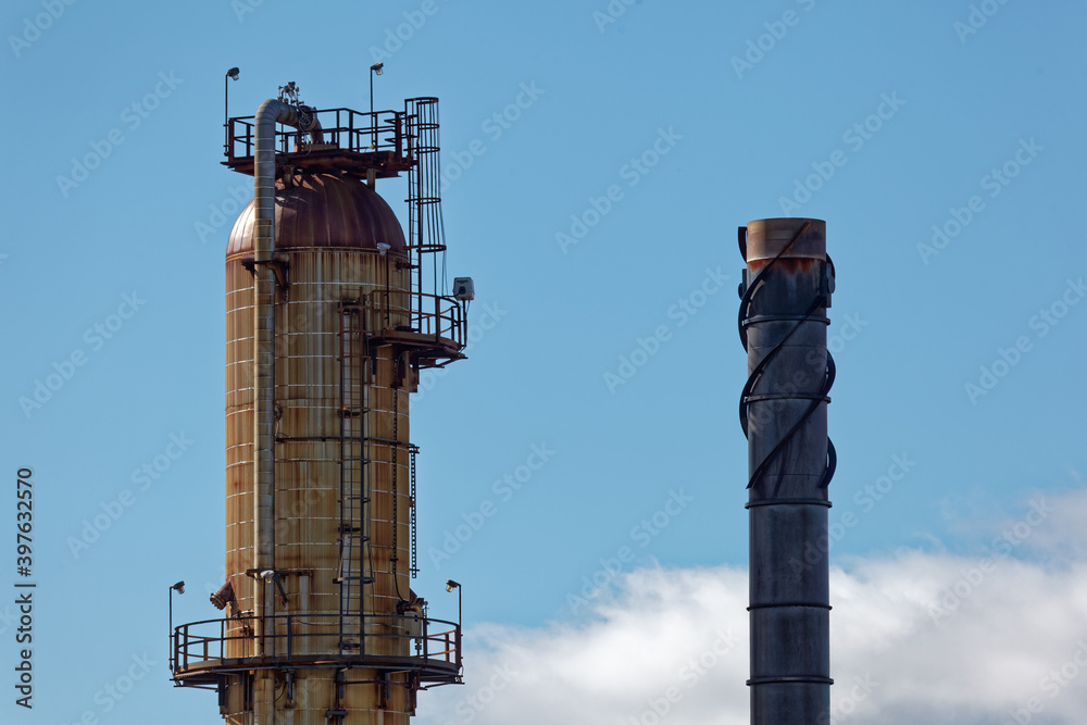 Sections of an old industrial oil refinery showing its age and rusting ...