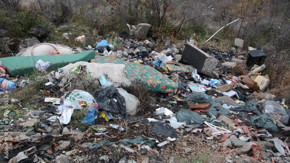 Wild garbage dump in nature. Open landfill site. Pile of garbage ...