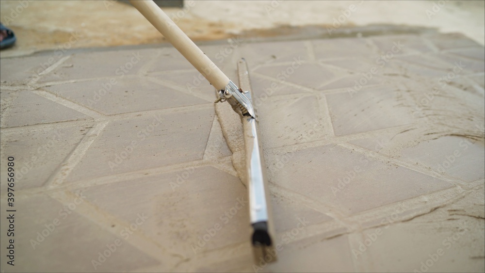 Wire for laying tiles close-up. Laying paving slabs, working with ...