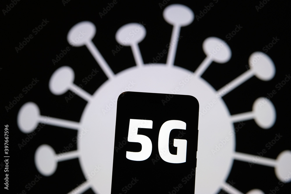 5G radiation in a shape of COVID-19. 5G letters on smartphone ...