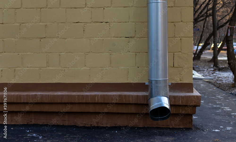 Rain pipe on the outside wall of the house. Drainpipe system in the ...