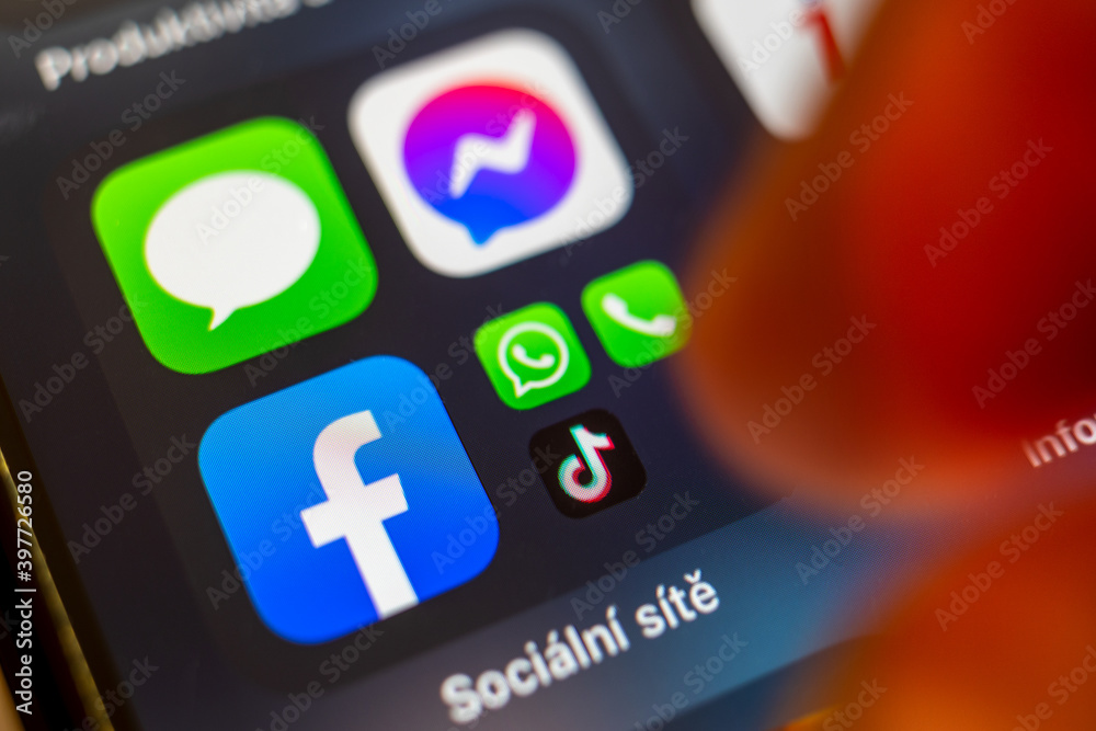 Foto de Smart phone with social media logo, a popular social network on ...