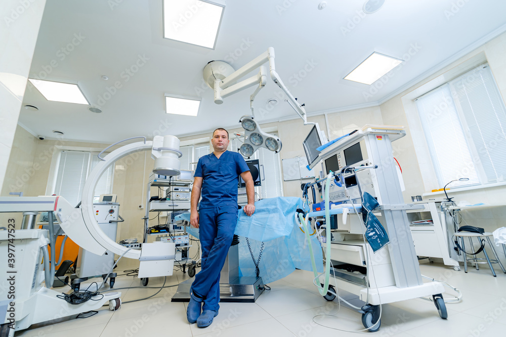 Neurourgeon in operating room with medical robotic surgery machine ...