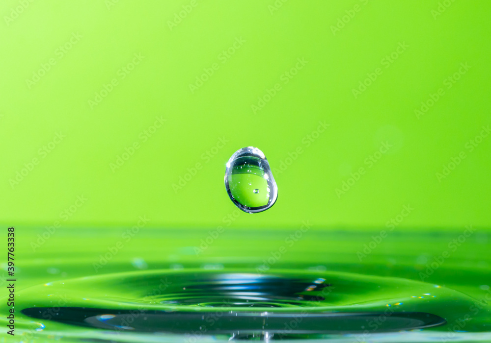 Water drop falling and impacting body of water. Stock Photo | Adobe Stock