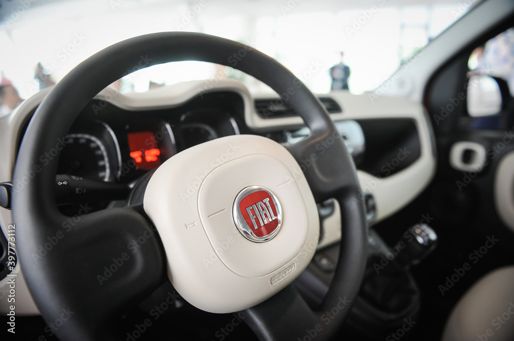Details from inside a Fiat car with the steering wheel and the Fiat ...
