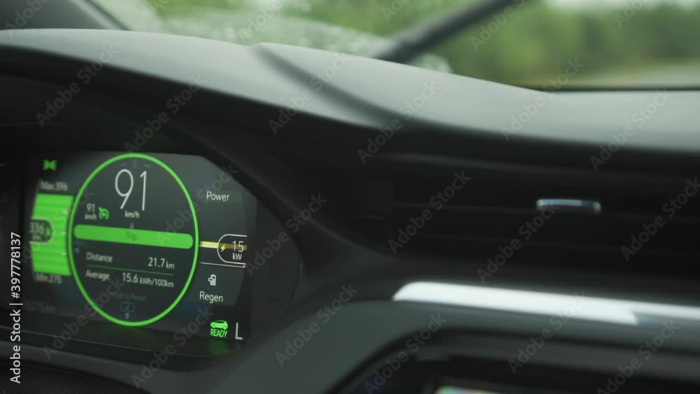 Electric car vehicle dashboard view during driving at 90 kilometers per ...