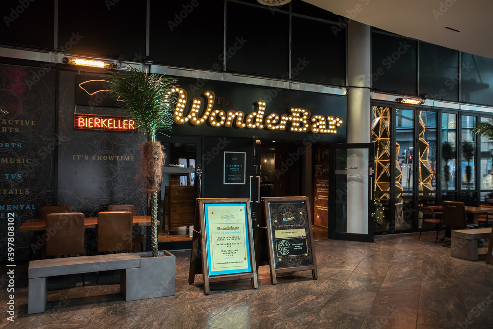 Entrance to Wonder Bar pub showing sign, signage, logo and branding ...