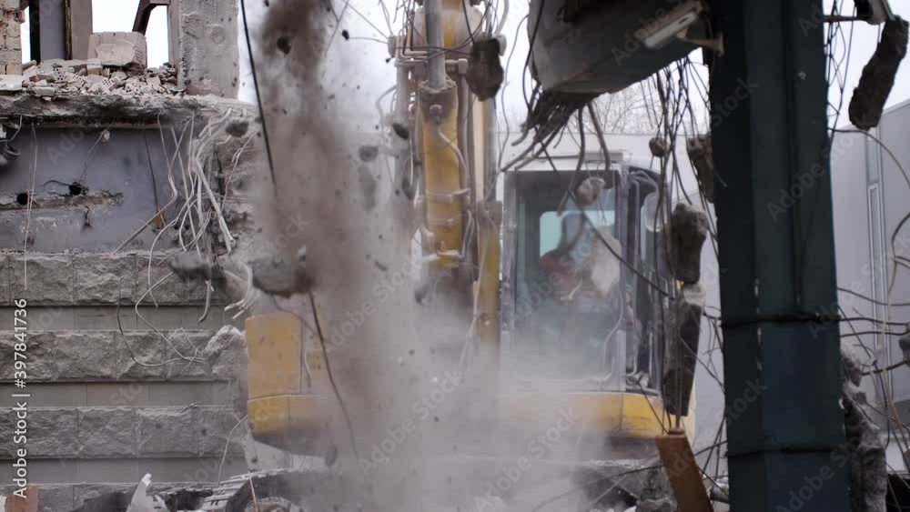 Construction waste debris wrecking a building with a crane Stock Video ...