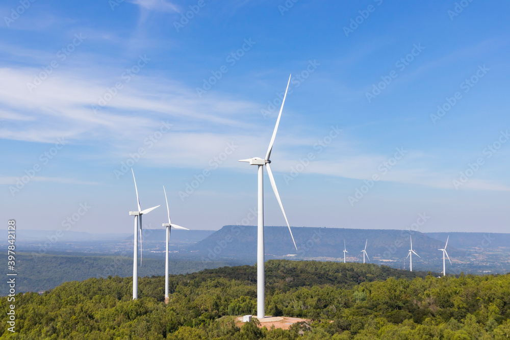 turbine having a large vaned wheel rotated by the wind to generate ...