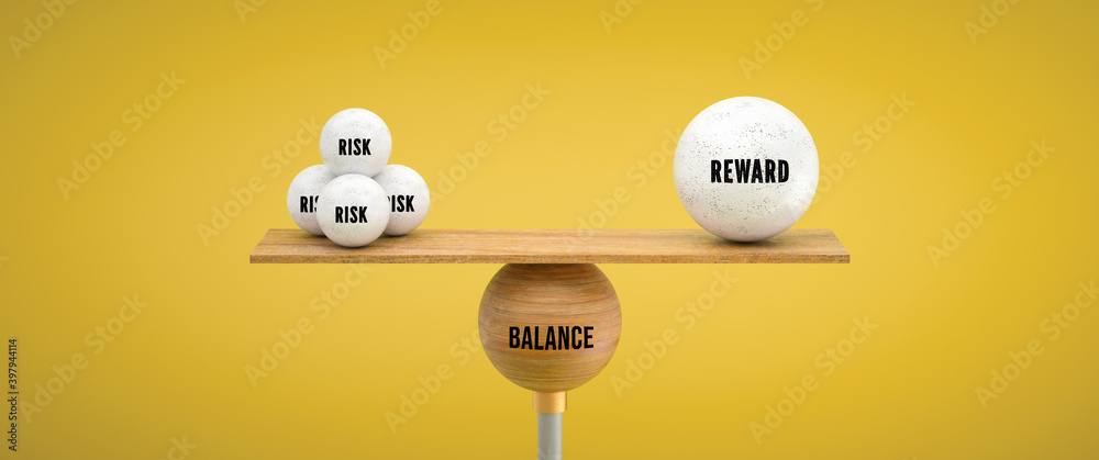 wooden scale balancing one big ball and four small ones with message ...