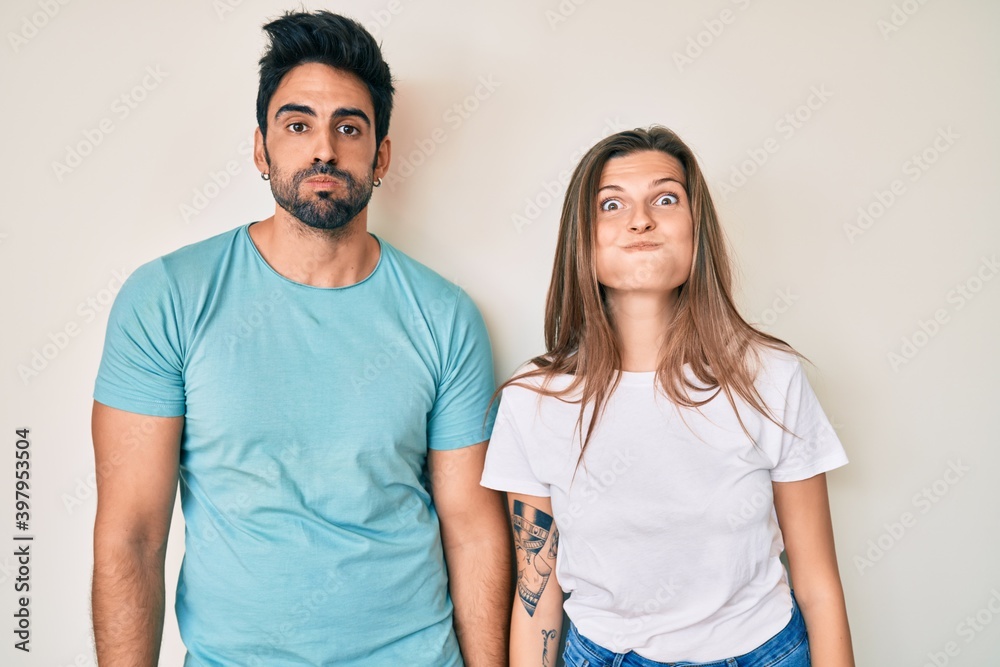 Beautiful young couple of boyfriend and girlfriend together puffing ...