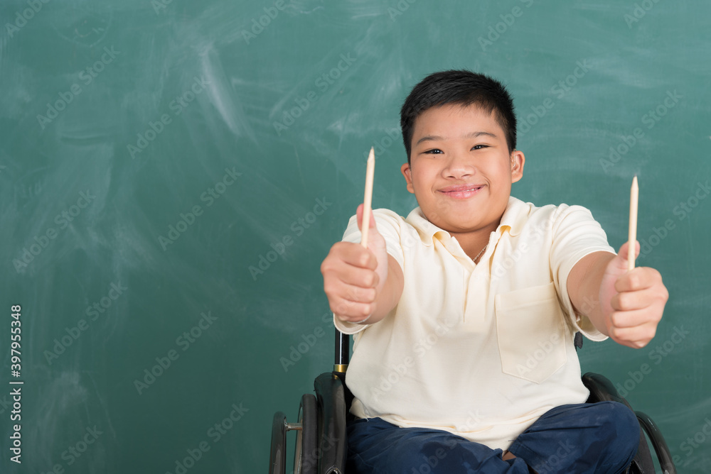 Portrait of young Asian disabled child student on wheelchair in happy ...