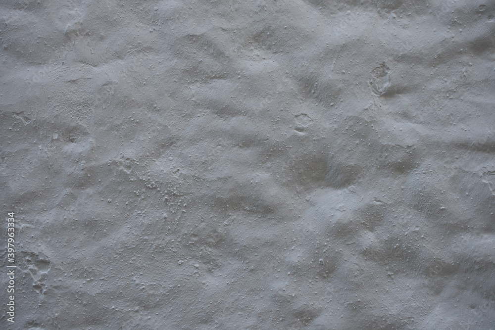 texture of the relief surface of cement or concrete. Rough white relief ...