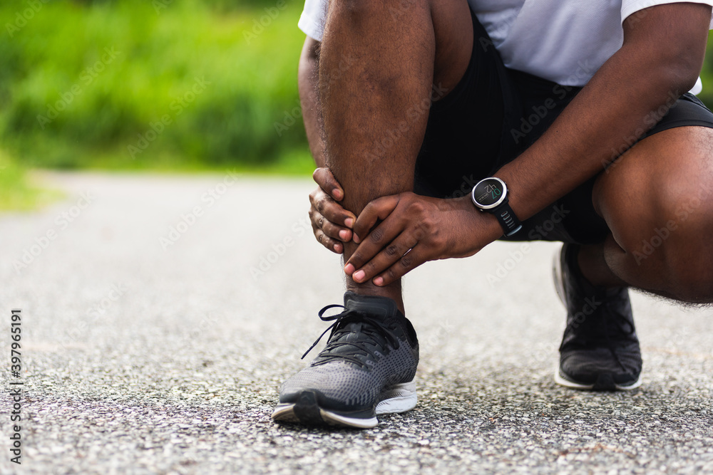 Close up Asian young sport runner black man wear watch hands joint hold ...