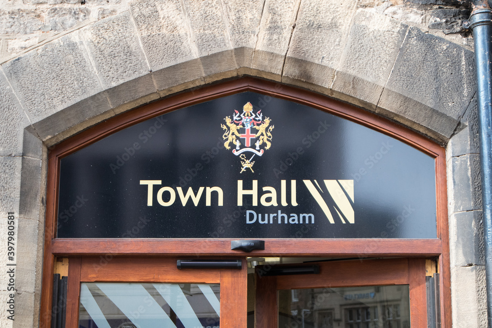Entrance to Durham Town Hall showing top of doors with sign and coat of ...