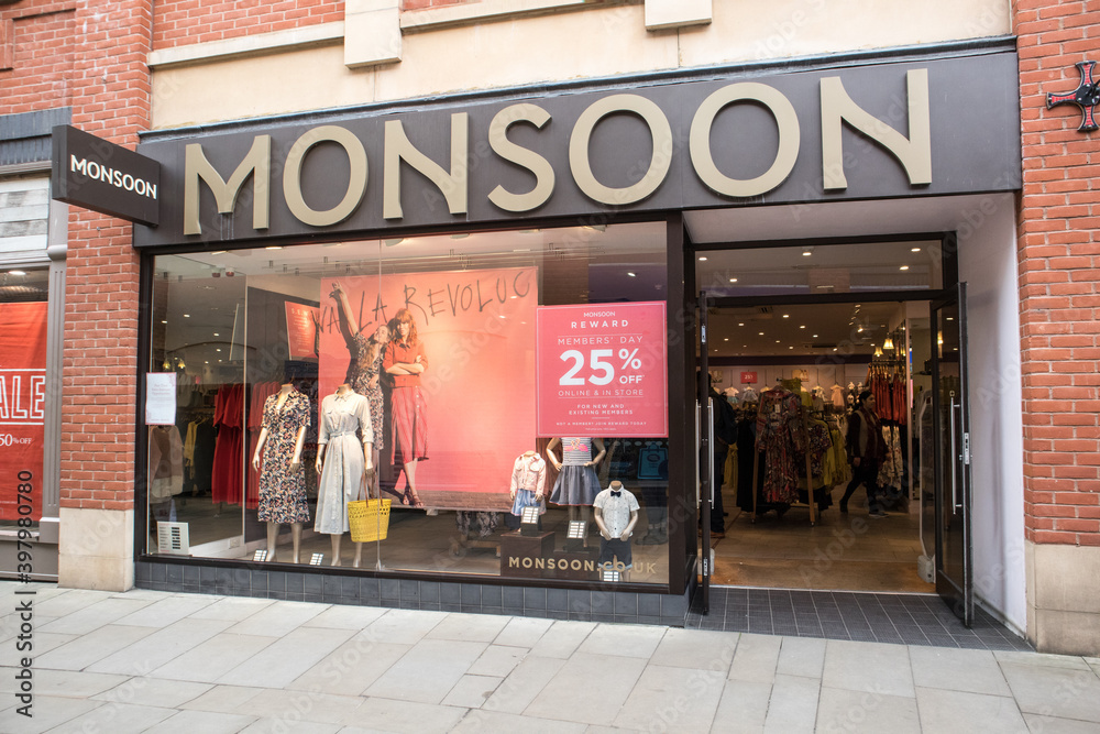 Entrance to Monsoon Fashion clothing store shop showing logo, sign ...