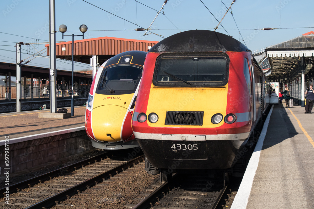 Class 43 LNER train on a platform next to modern Azuma train while ...