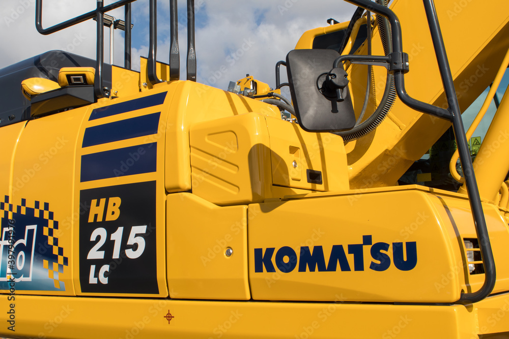 Large yellow Komatsu industrial digger machine showing company name ...