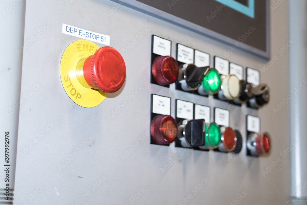 Control panel including emergency stop button in an industrial factory ...