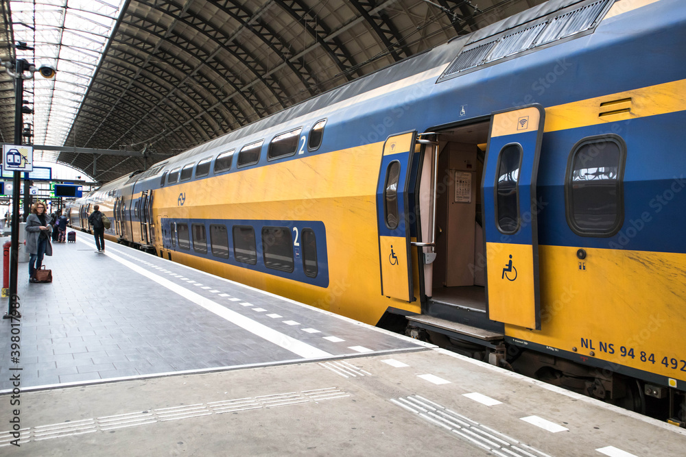 Train at a platform inside a railway station with doors open prior to ...