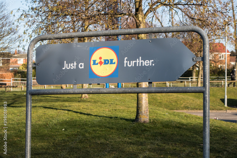 Just a Lidl Further car park sign for Lidl supermarket with grass and ...