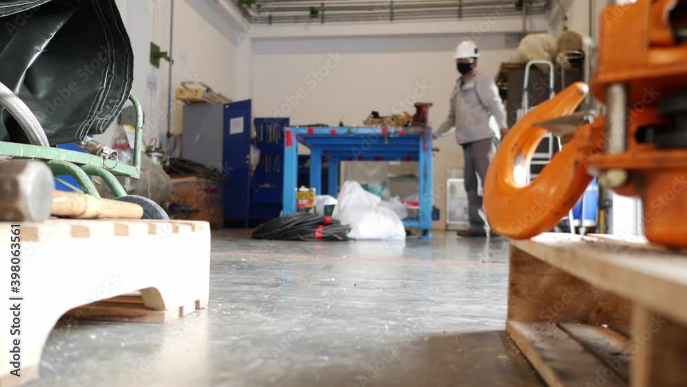 The maintenance technician is wiping the tools before putting them in ...