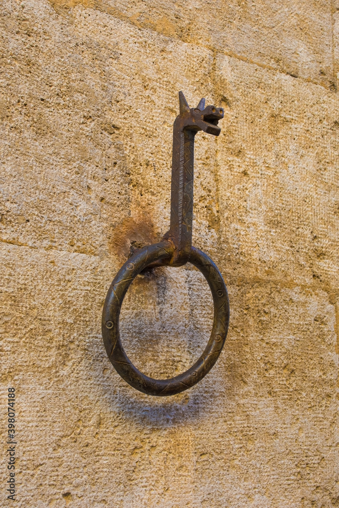 An iron ring which used to be used to tie horses to in a wall in the ...