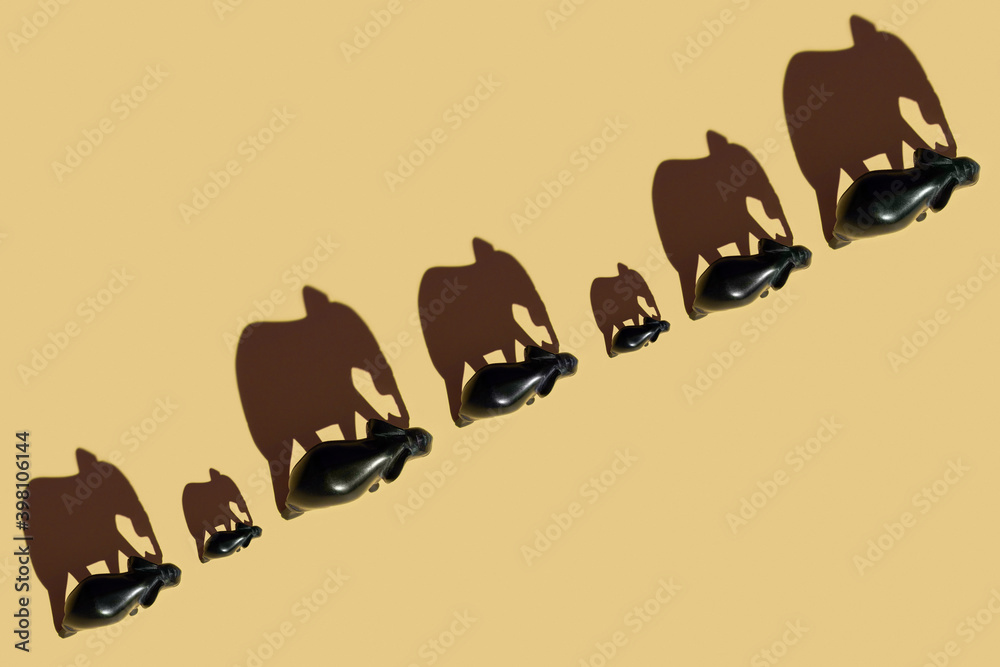 Seven figures of elephants in a column. Photographed from above with ...