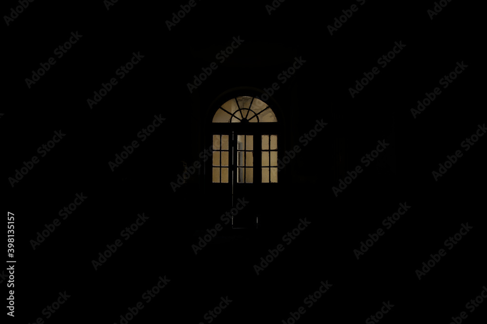 poor vintage arch shape window inside old residence hall in dark indoor ...