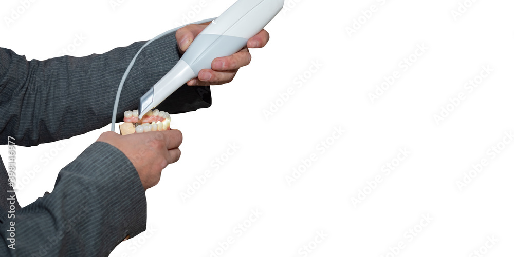 Dental intraoral scanner in hands of a man. Man in a suit holds an ...