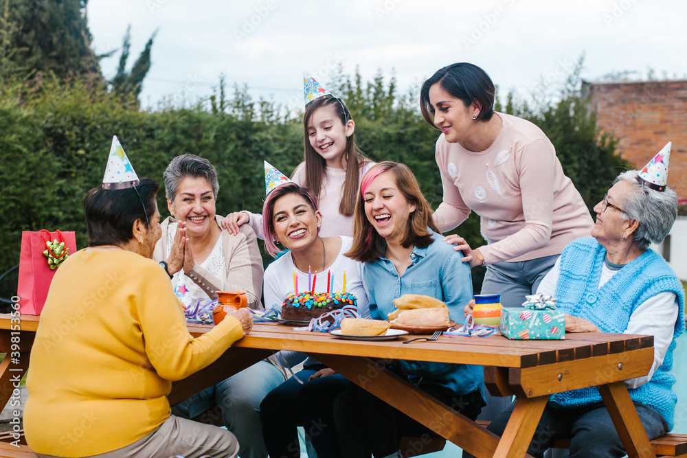 Latin Family happy birthday celebration garden party outside in the ...